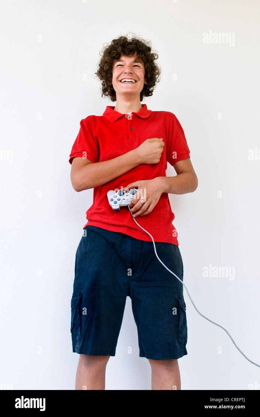 Boy playing video game Stock Photo - Alamy