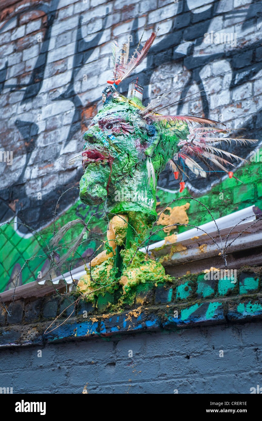 London East End Brick Lane area graffiti street art mural green figure ...