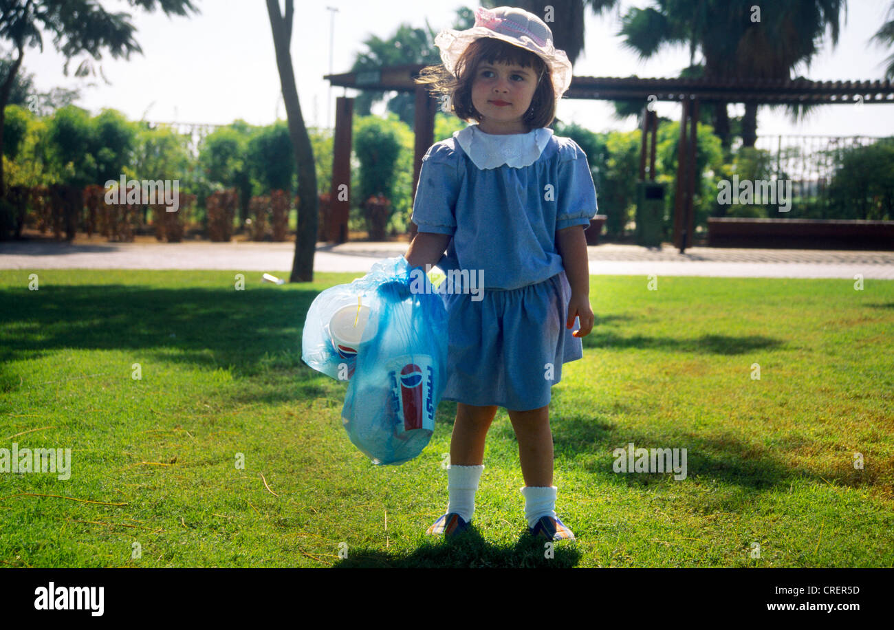 Dubai UAE Safa Park Young Girl Wearing Hat Carrying Plastic Bags Stock ...