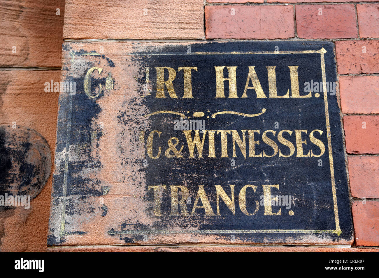 old worn painted sign for court hall public and witnesses entrance on ...
