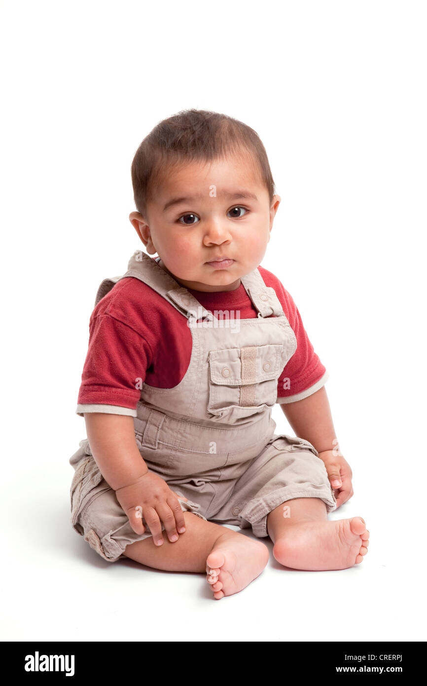 Solemn Indian baby 5 months old sitting up and concentrating Stock ...