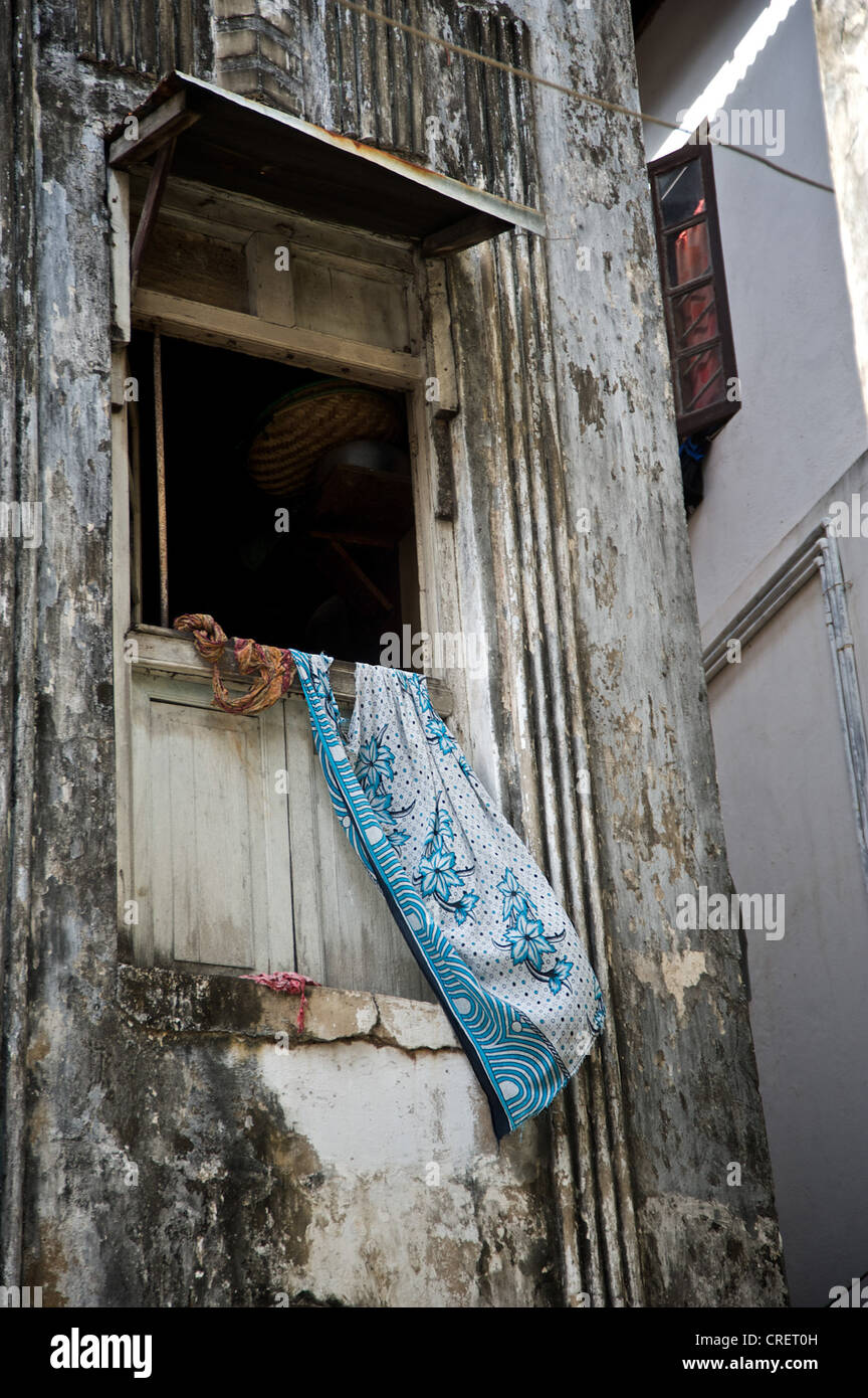 Old window with fabric hanging out from it.Mombasa, Kenya, East Africa ...