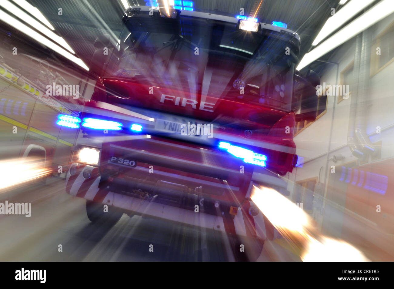 A Moving Fire Engine with Blue Lights On Stock Photo - Alamy