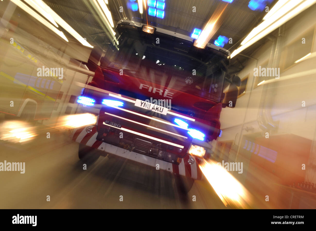 A Moving Fire Engine with Blue Lights On Stock Photo - Alamy