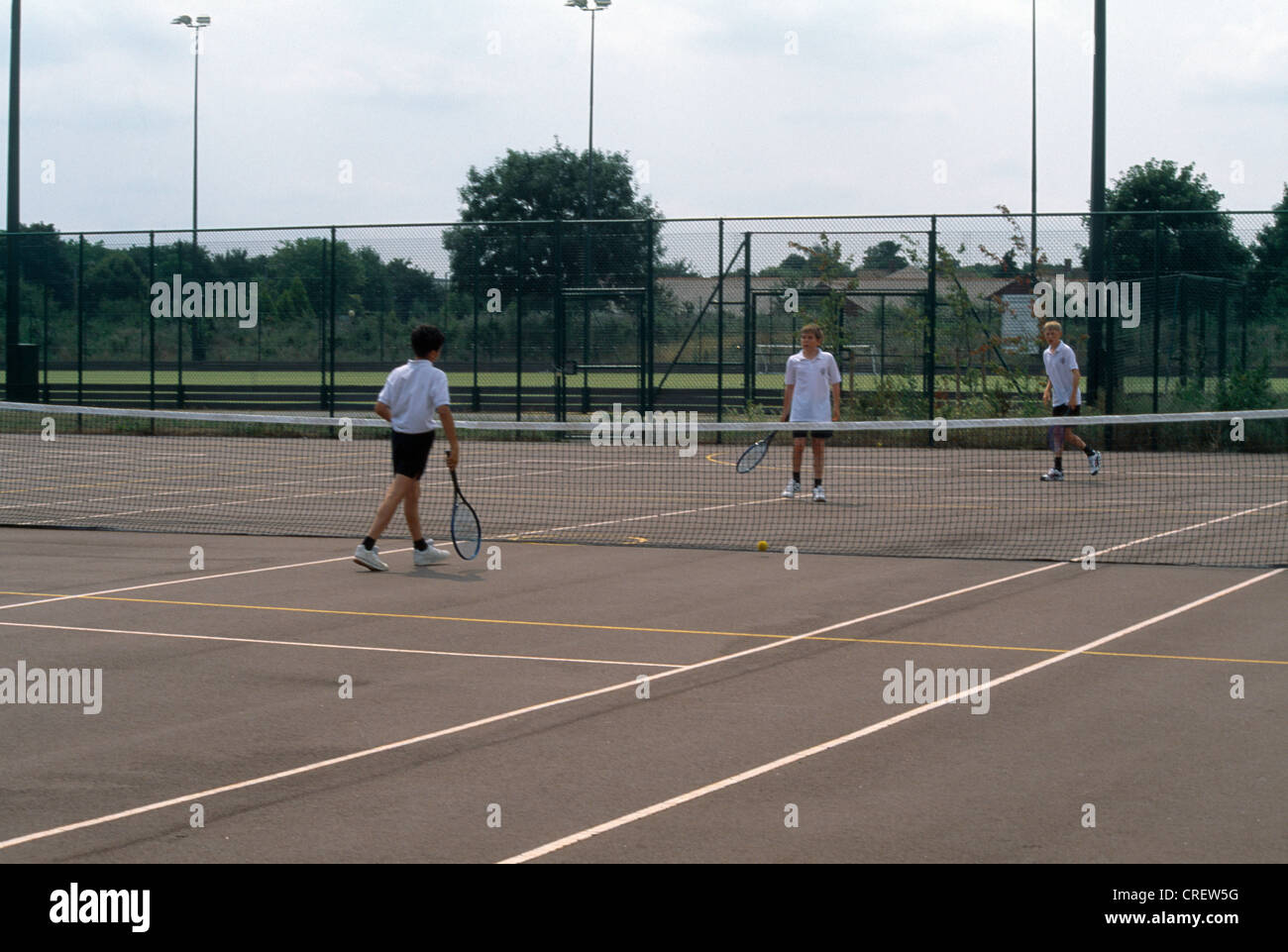 Boys Playing Tennis In Physical Education At High School Stock Photo ...