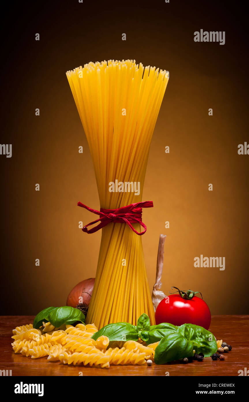 still life with raw spaghetti pasta and vegetables Stock Photo - Alamy