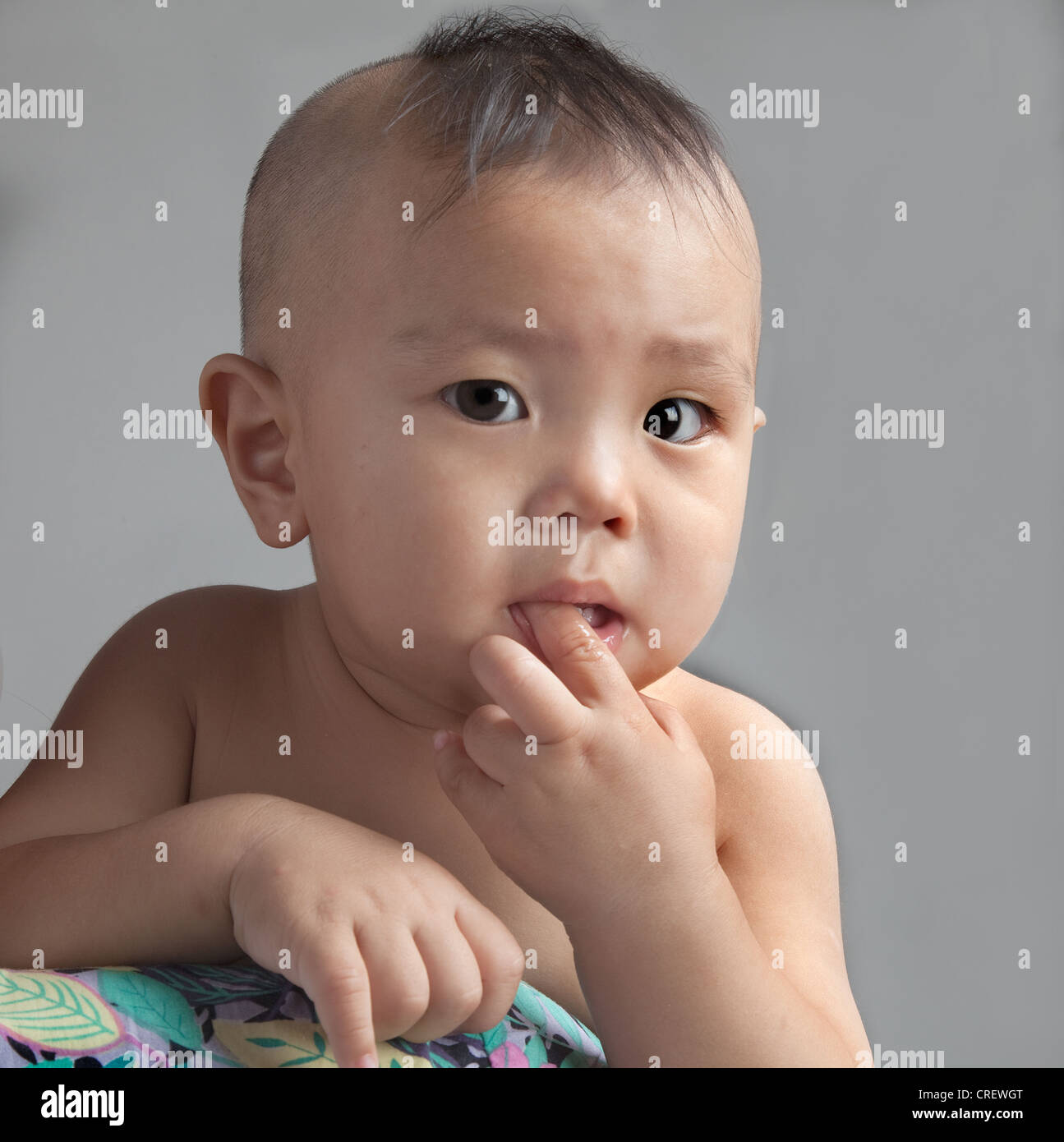 10 month old Chinese baby, with typical haircut, sucking finger ...