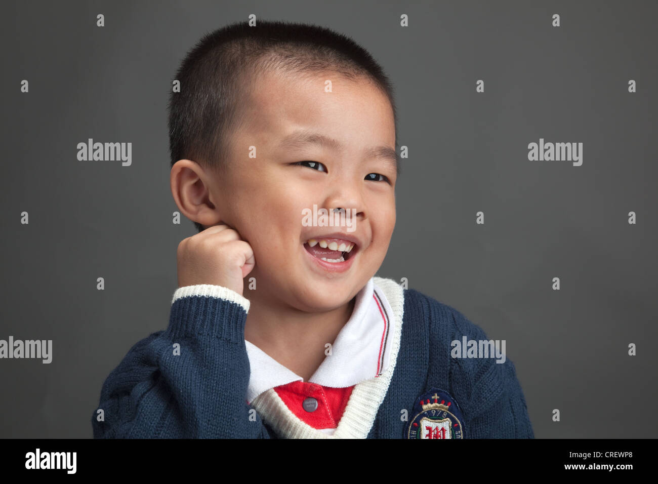 Head and shoulders portrait of Chinese 3 year old boy laughing Stock ...