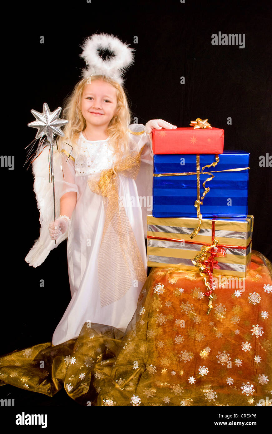 little girl as Christ Child with presents Stock Photo - Alamy