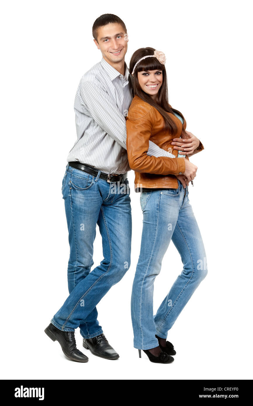 Portrait of romantic young couple hugging each other on white ...