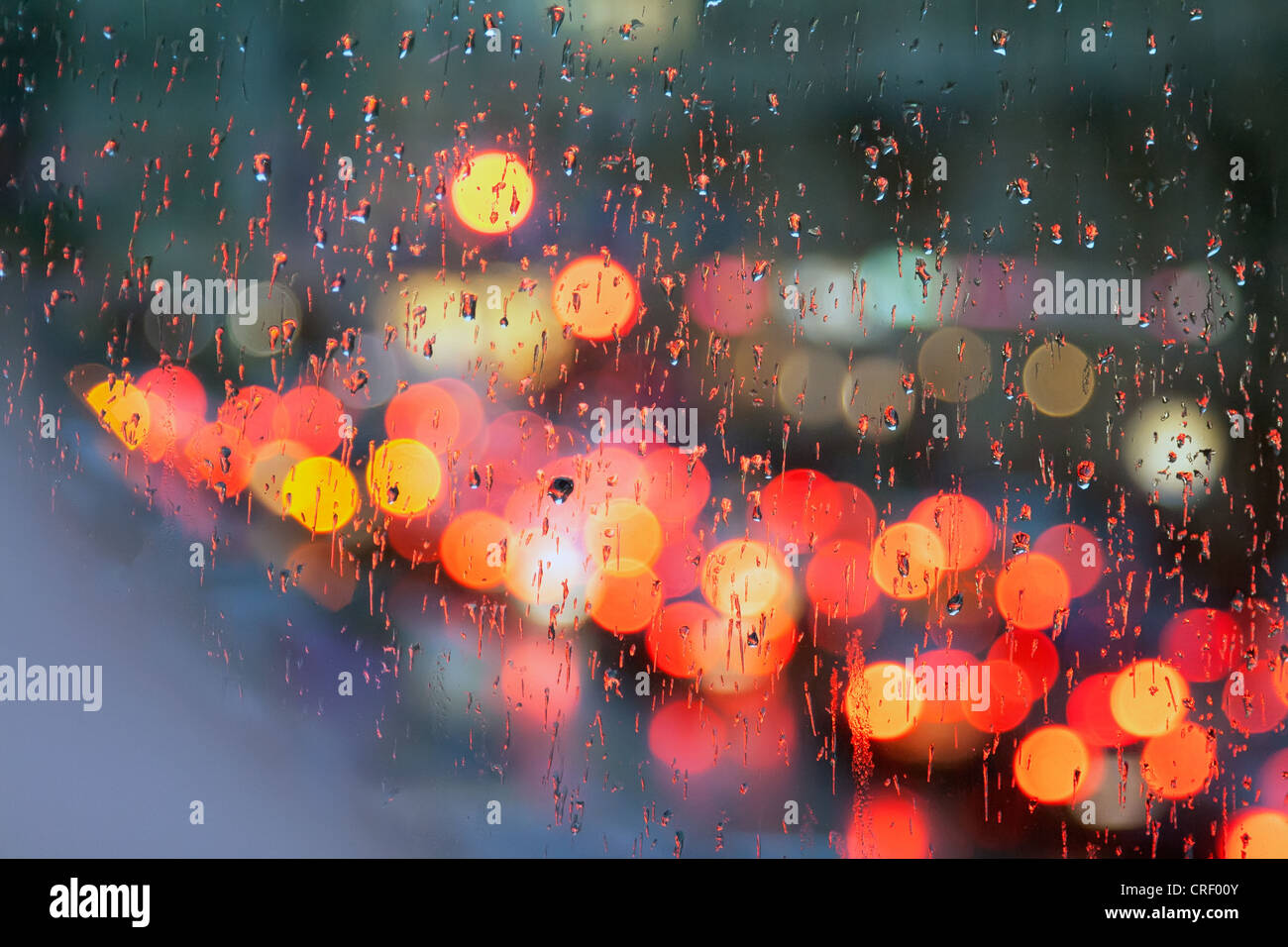 City at night in a glass with drops Stock Photo - Alamy