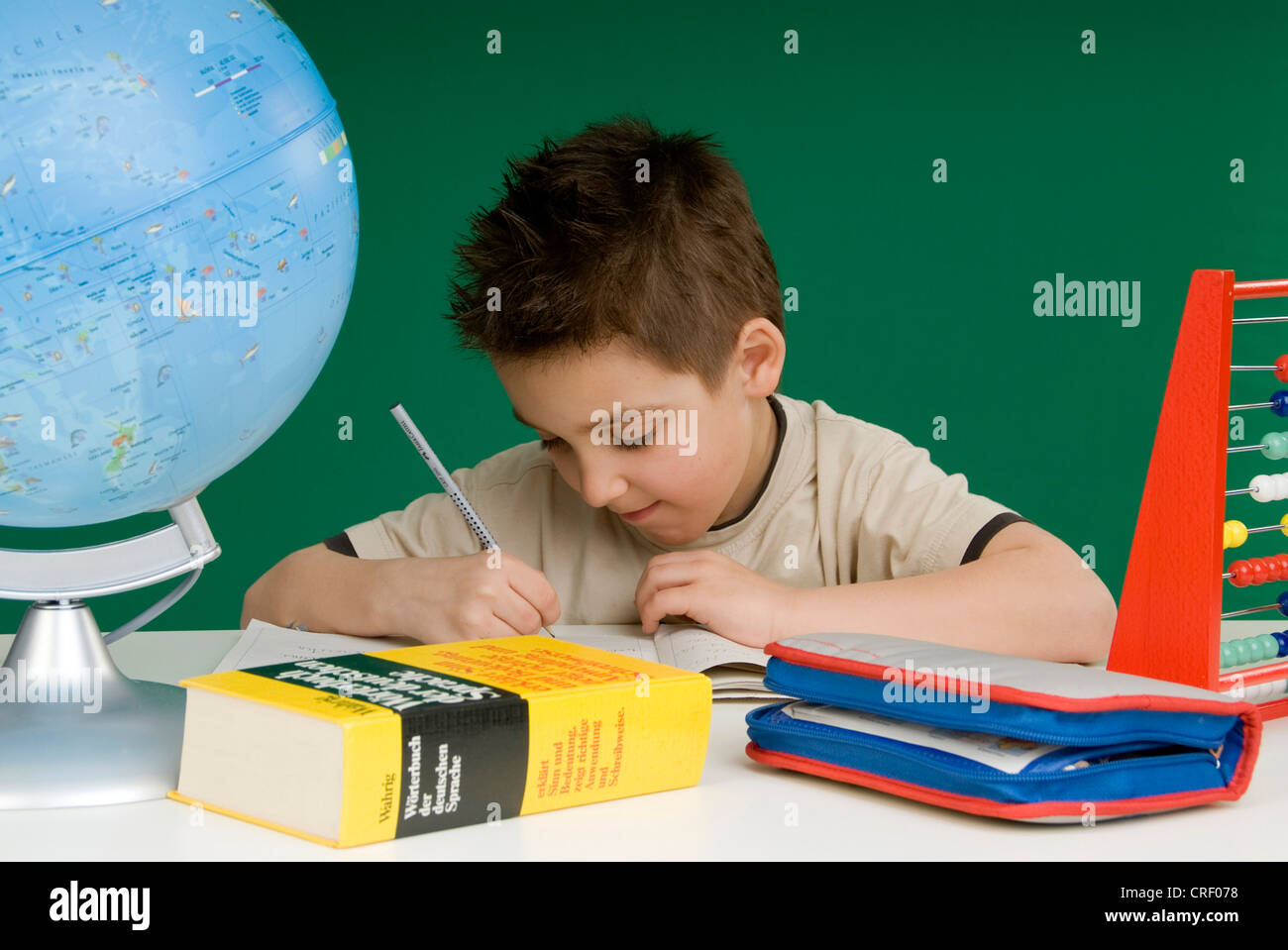 schoolboy doing homework Stock Photo - Alamy