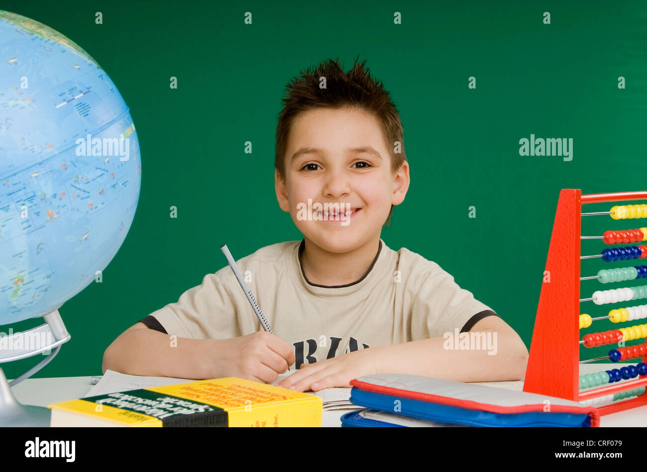 schoolboy doing homework Stock Photo - Alamy