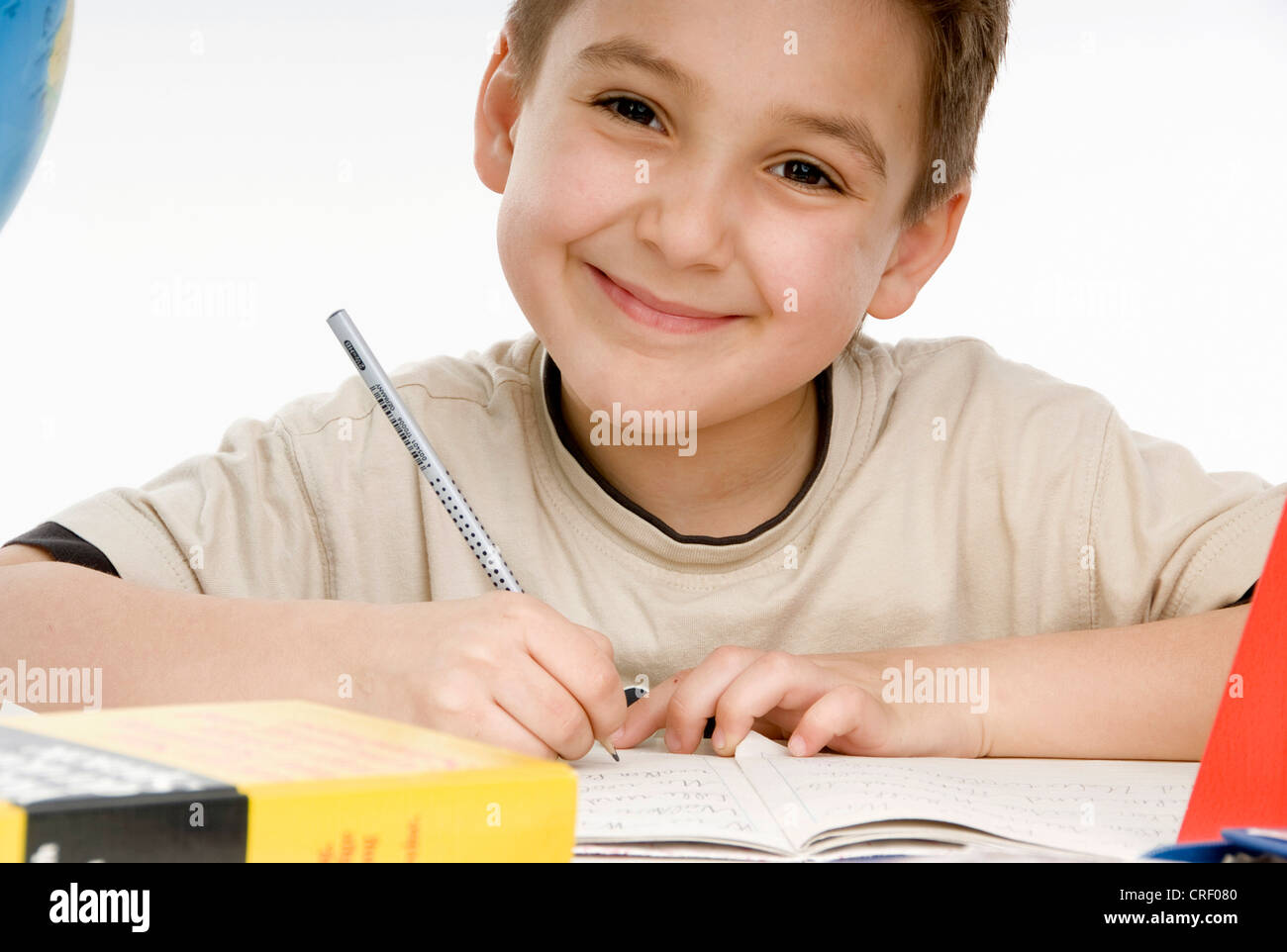 schoolboy doing his homework Stock Photo - Alamy