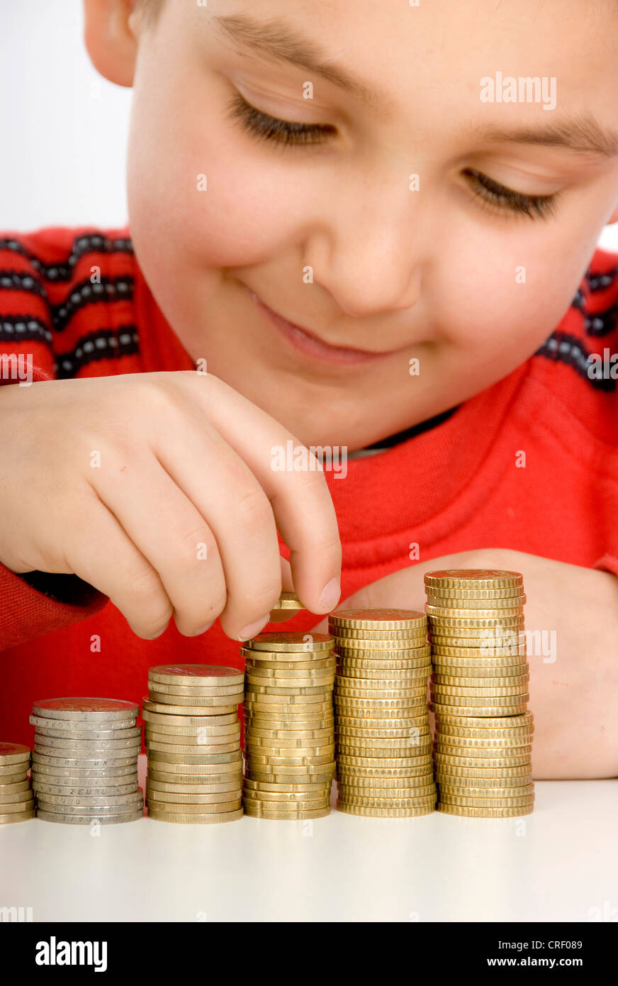 boy with euro coins Stock Photo - Alamy