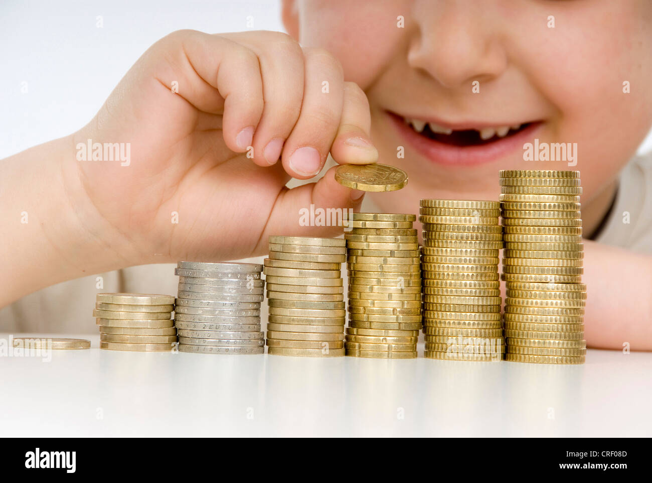 Kids collecting coins hi-res stock photography and images - Alamy