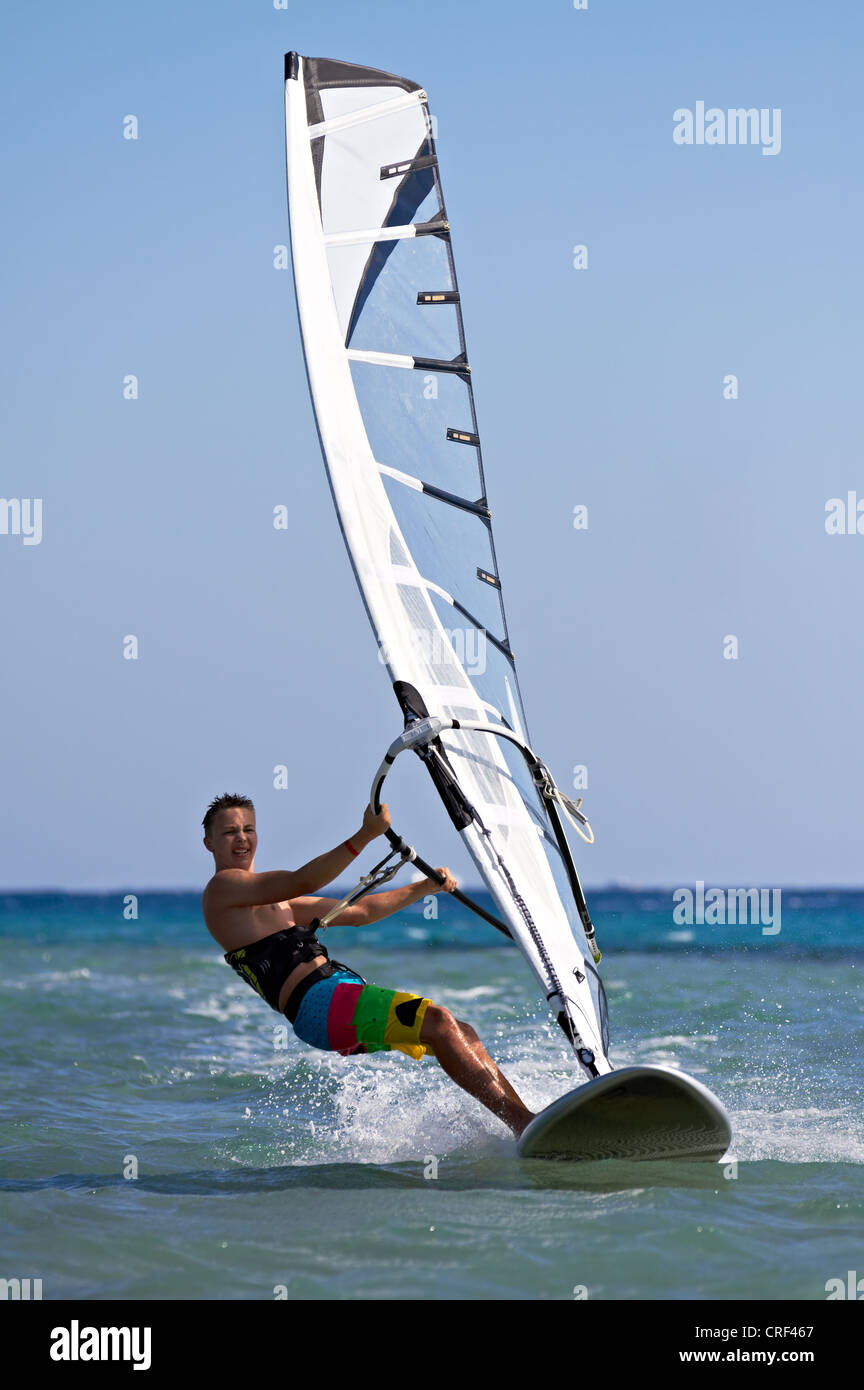 Front view of a windsurfer passing by Stock Photo - Alamy