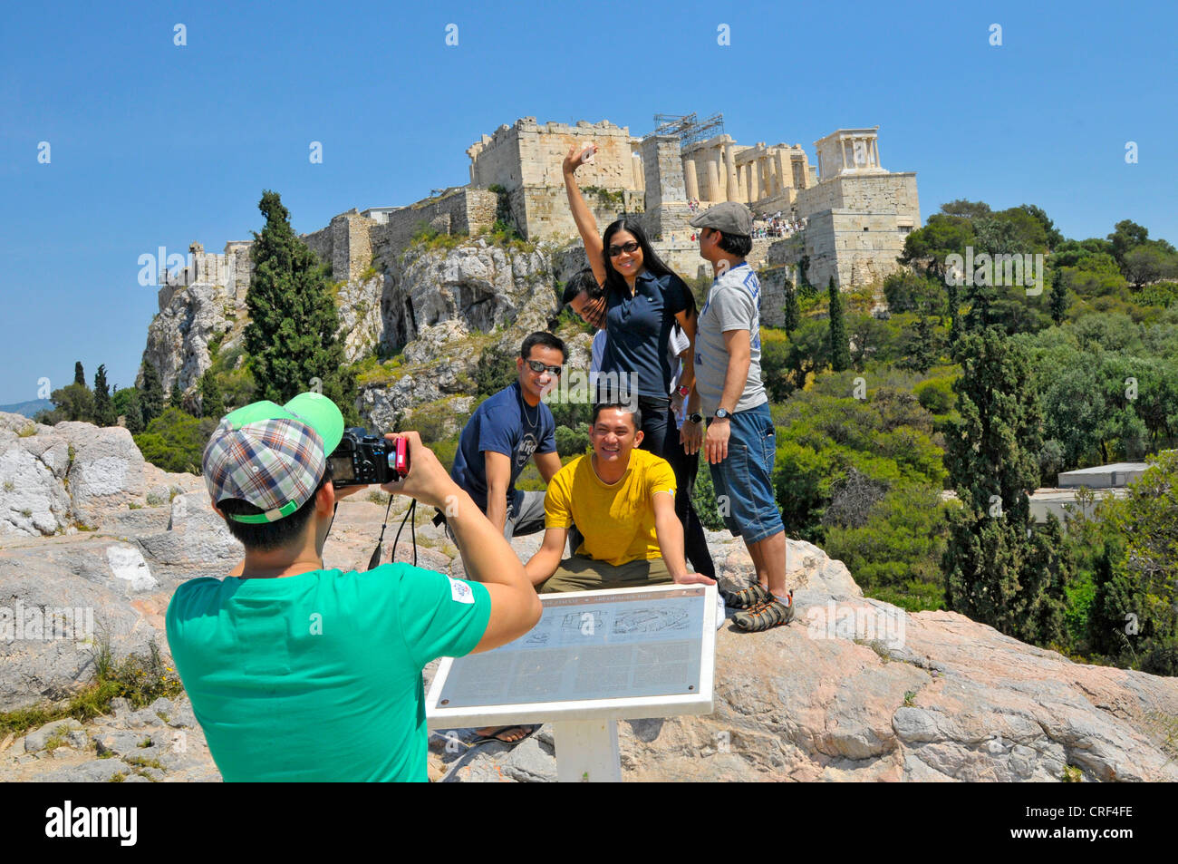 Family poses in front of The Acropolis Athens Greece Ancient Building ...