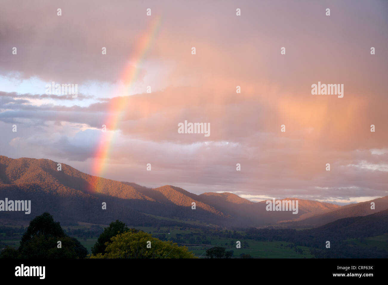 Rainbow in evening sky over Falls Creek Victoria Australia Stock Photo ...