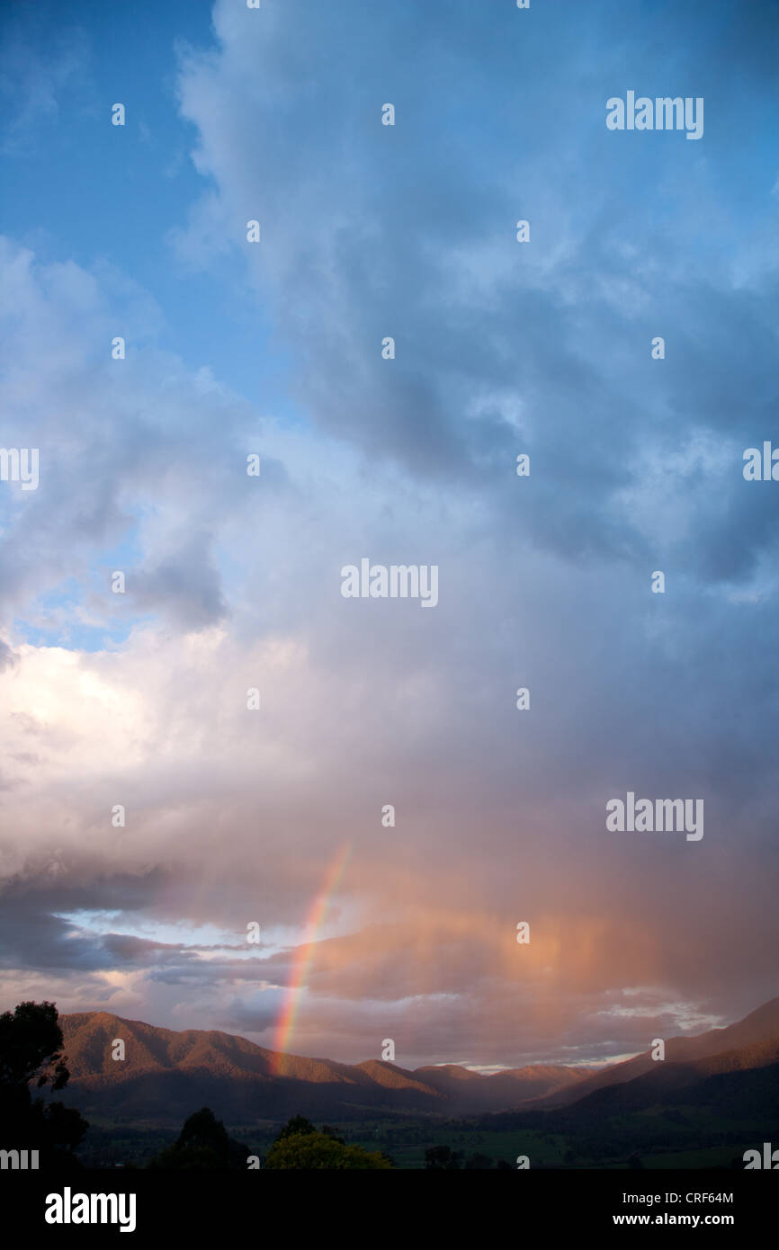 Rainbow in evening sky over Falls Creek Victoria Australia Stock Photo ...