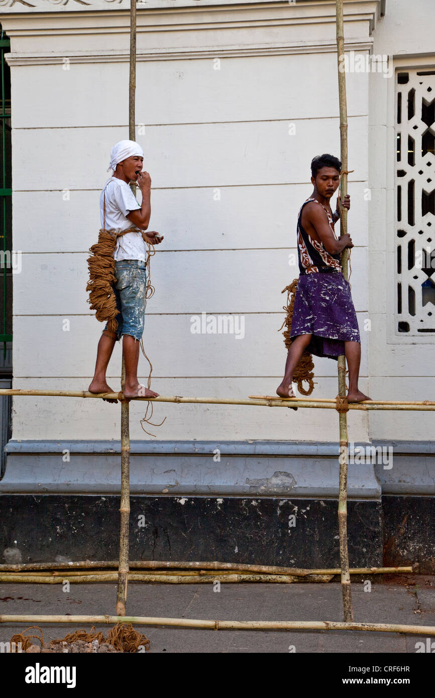 Myanmar, Burma, Yangon. Men Working on Bamboo Scaffolding Stock Photo ...