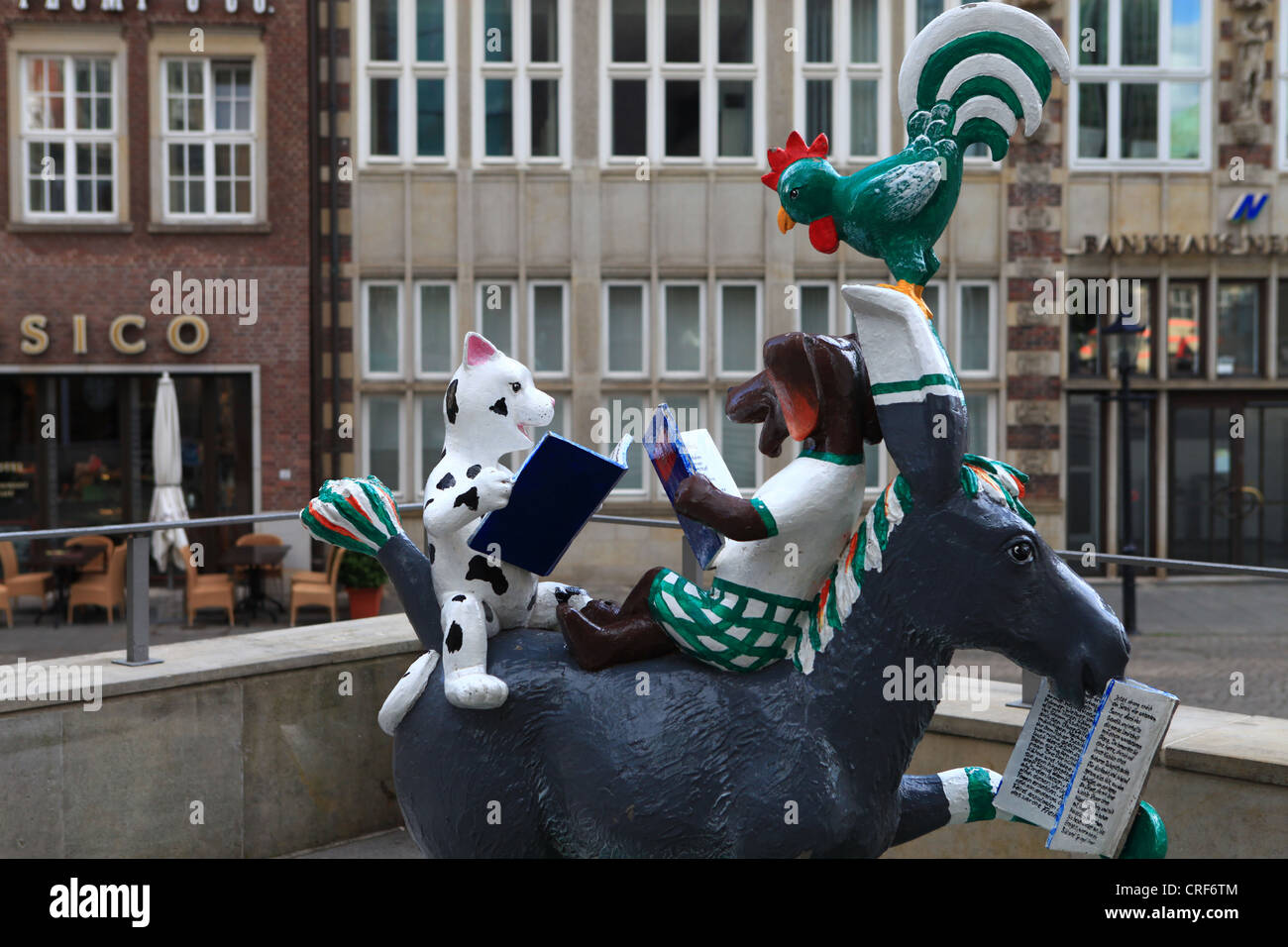 Sculpture of The Bremen Town Musicians reading books on Bremen street ...