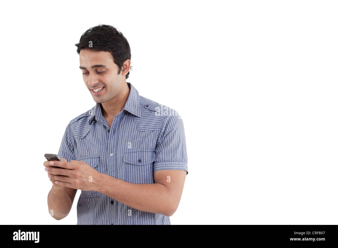 Young man text messaging Stock Photo - Alamy