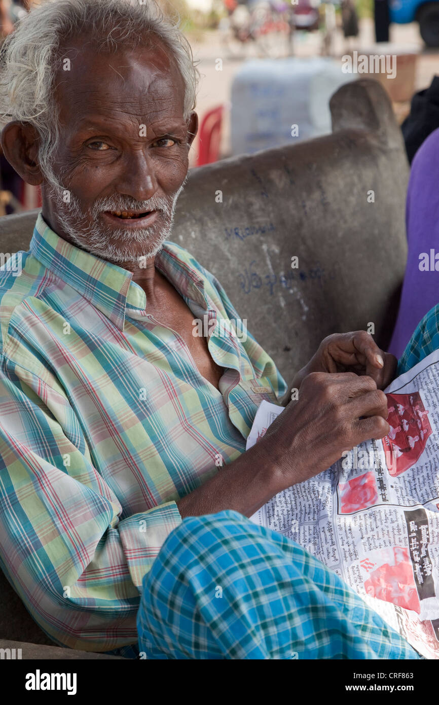 Myanmar, Burma, Yangon. Old Man Reading Newspaper Stock Photo - Alamy