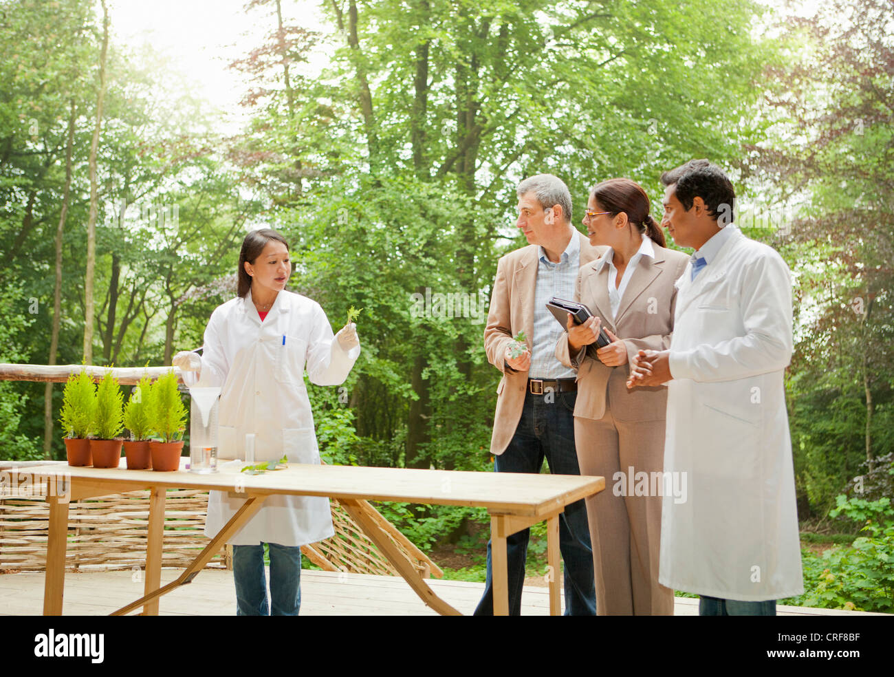 Business people talking scientists hi-res stock photography and images ...