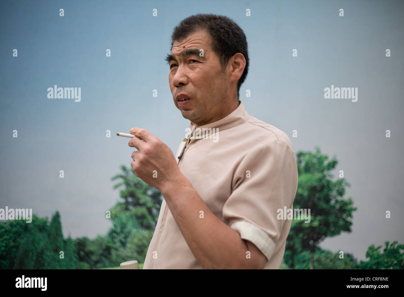 Chinese man smoking cigarette, in Beijing, China Stock Photo - Alamy