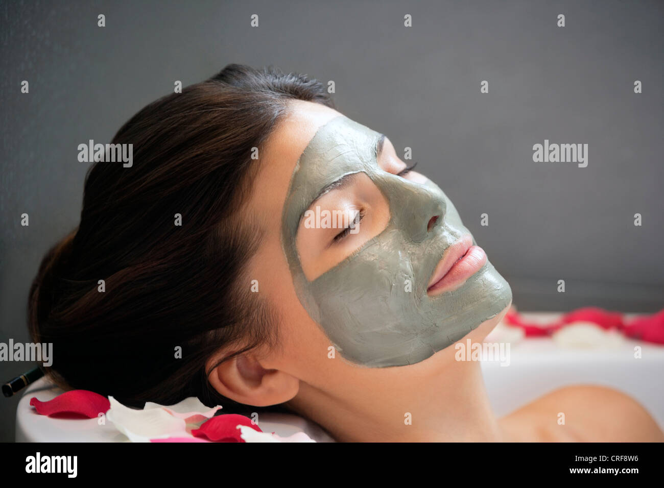 Woman with face mask relaxing in bath Stock Photo - Alamy