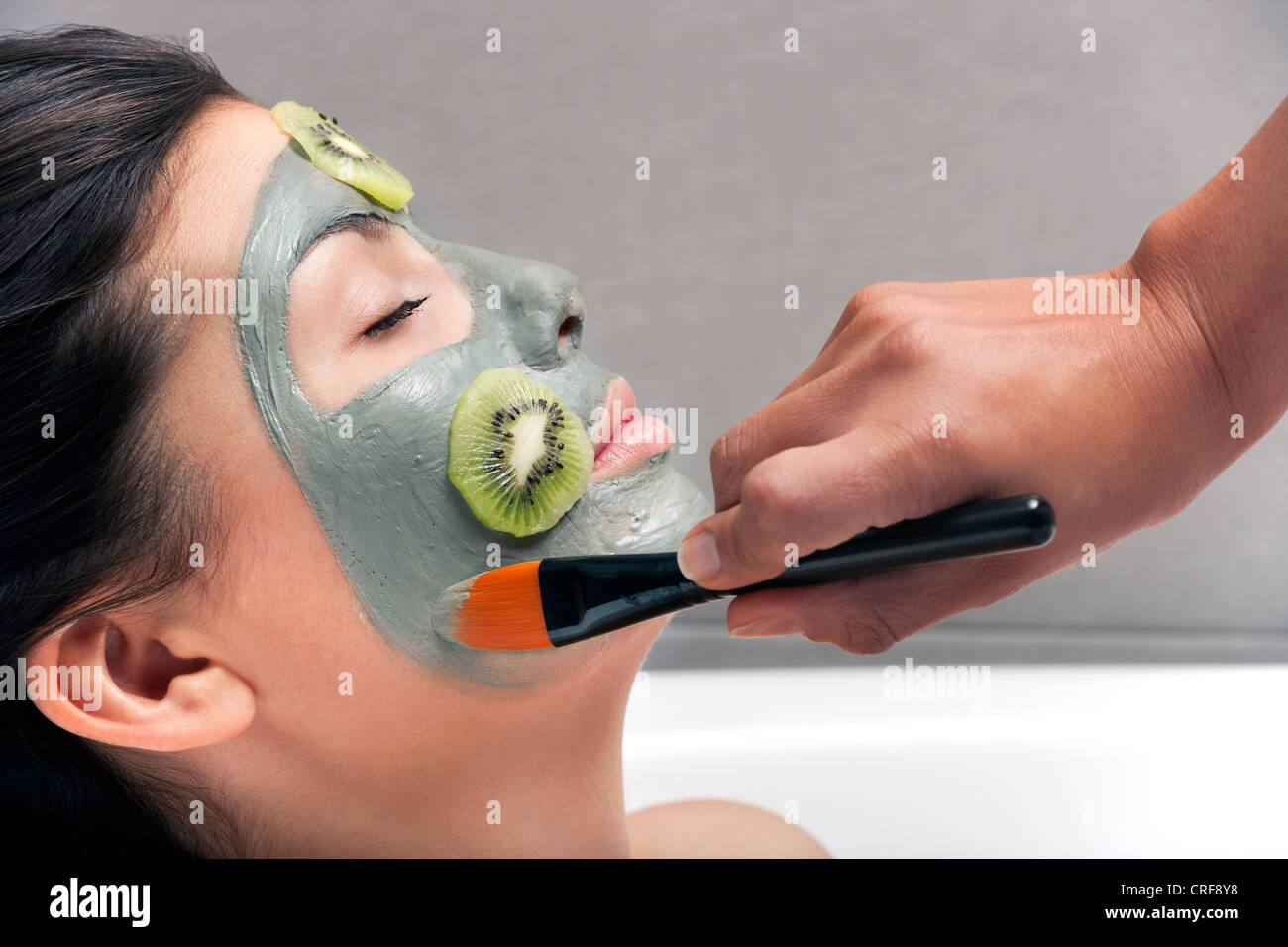 Woman having skin mask applied in bath Stock Photo - Alamy