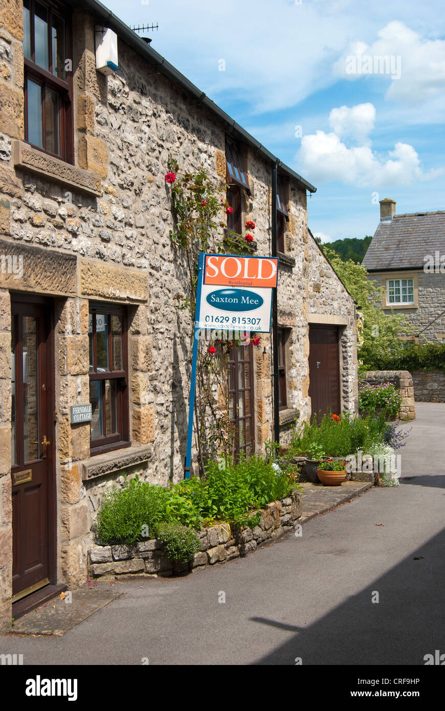 Derbyshire Cottage with Sold sign Stock Photo - Alamy