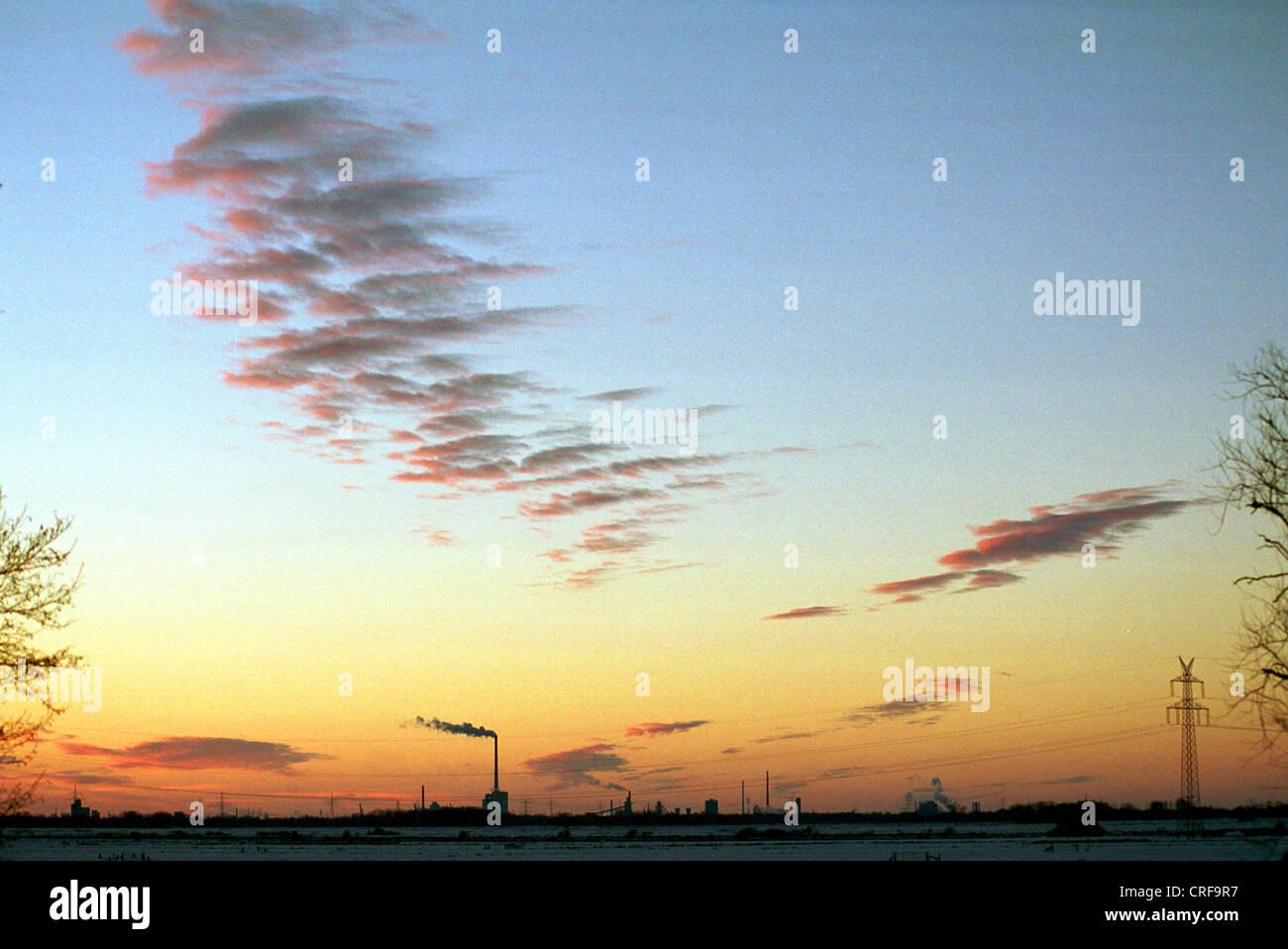 Germany, evening sky and smoking chimney Stock Photo - Alamy