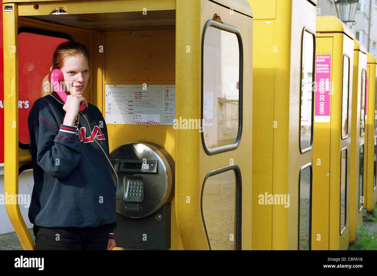 Berlin, Germany, girl phoned in a public phone booth Stock Photo - Alamy