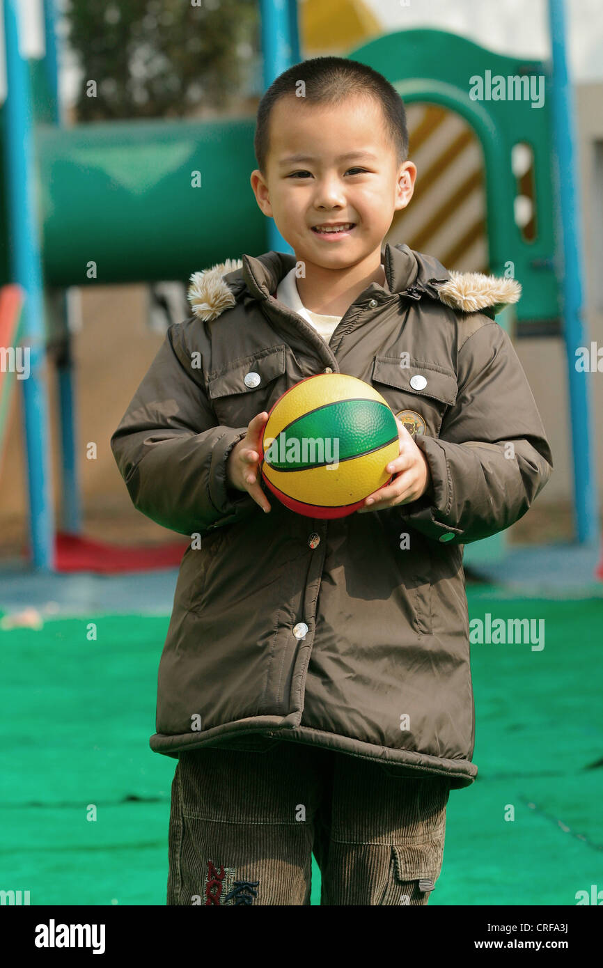 Cute chinese children playing balls hi-res stock photography and images ...