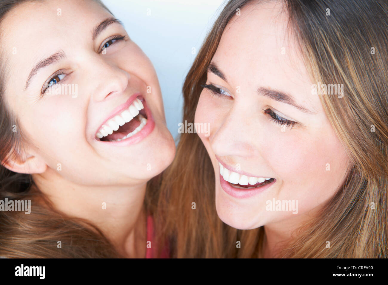 Close up of womens smiling faces Stock Photo - Alamy