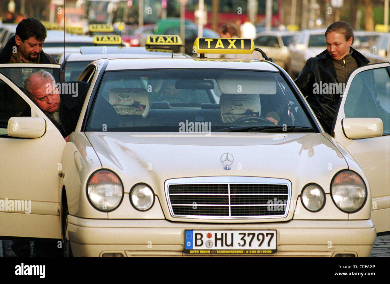 Berlin, Germany, people get into a taxi at the Zoo Station Stock Photo ...