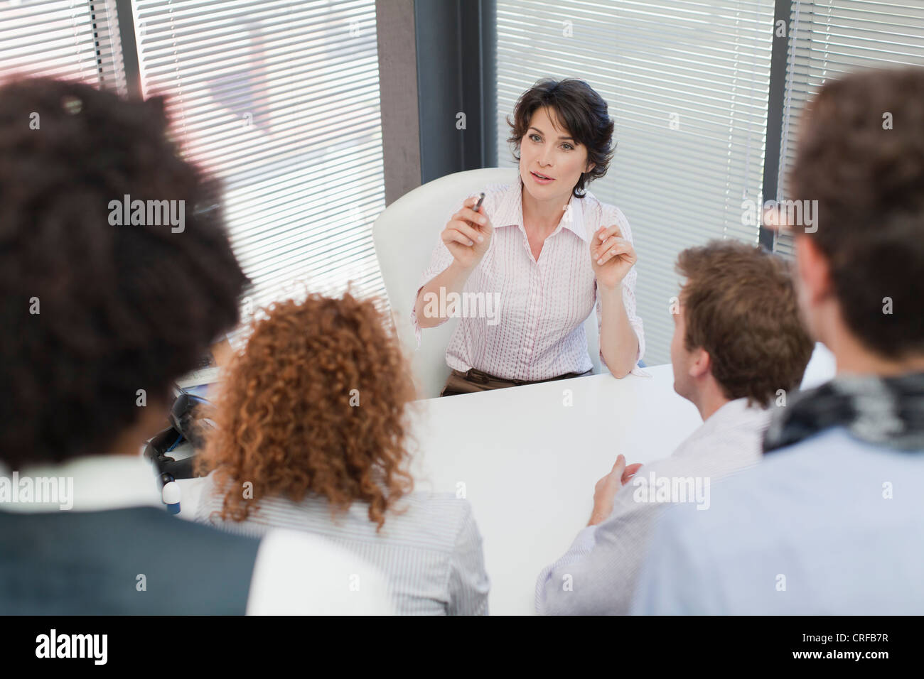 Business people talking in office Stock Photo - Alamy