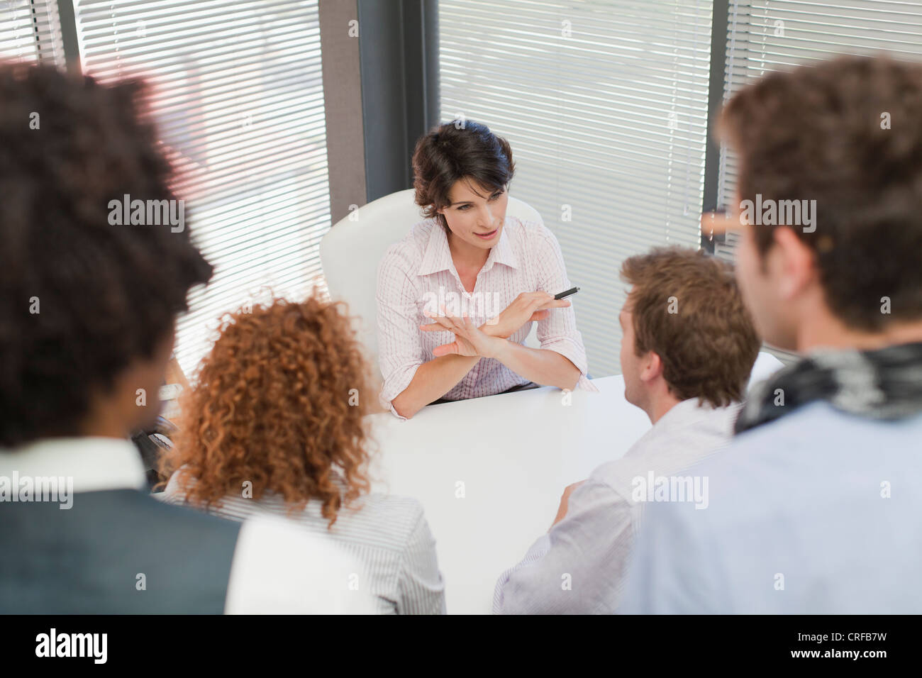 Business people talking in office Stock Photo - Alamy
