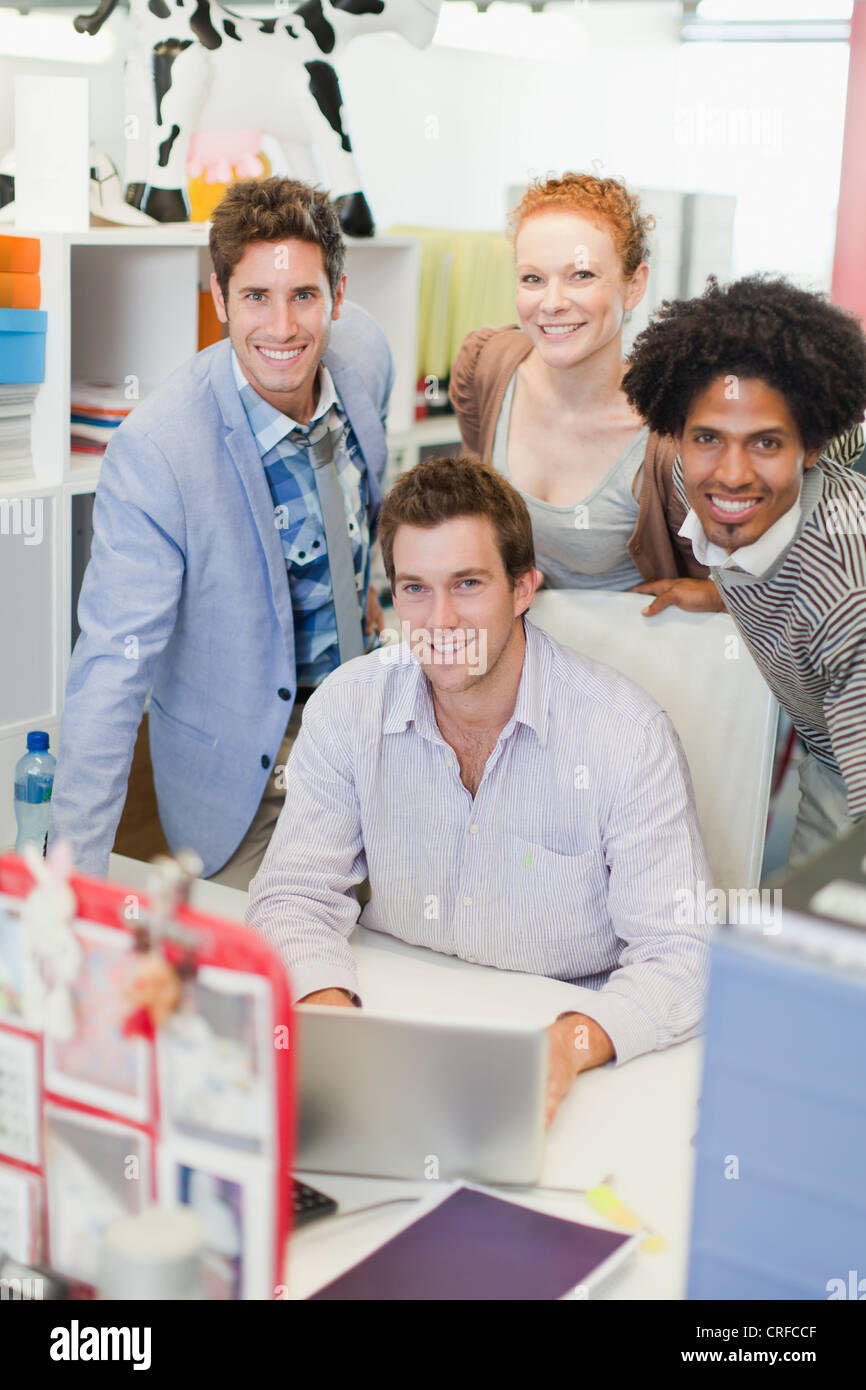 Business people smiling in office Stock Photo - Alamy