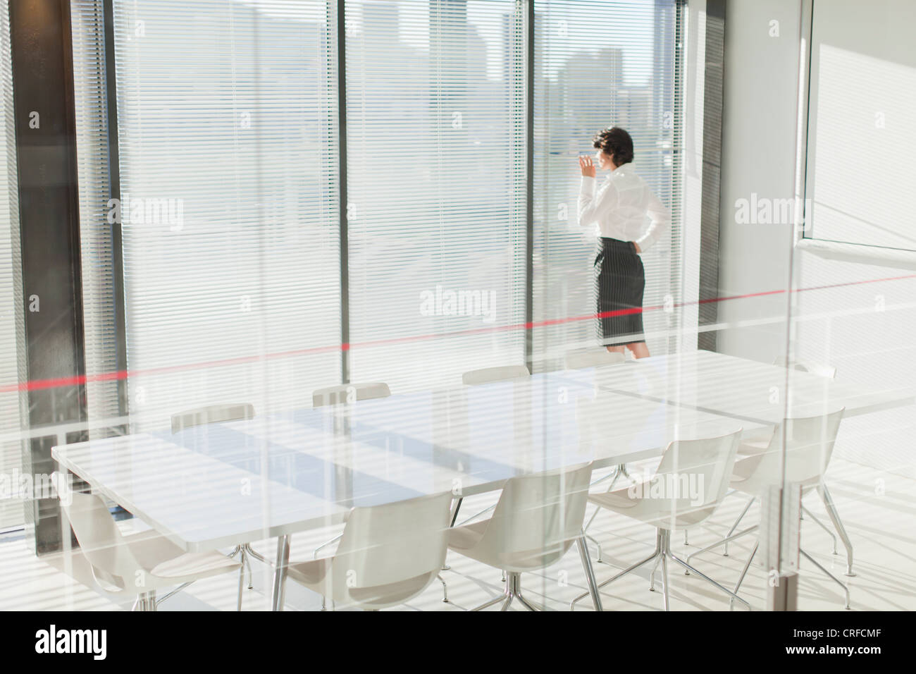 Women peering out the window hi-res stock photography and images - Alamy