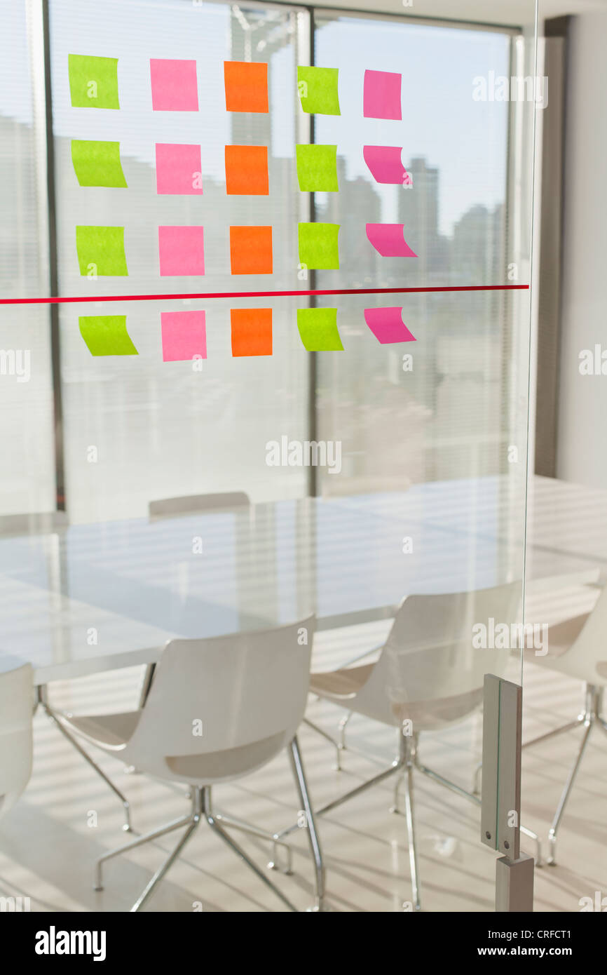 Colorful sticky notes on office window Stock Photo - Alamy