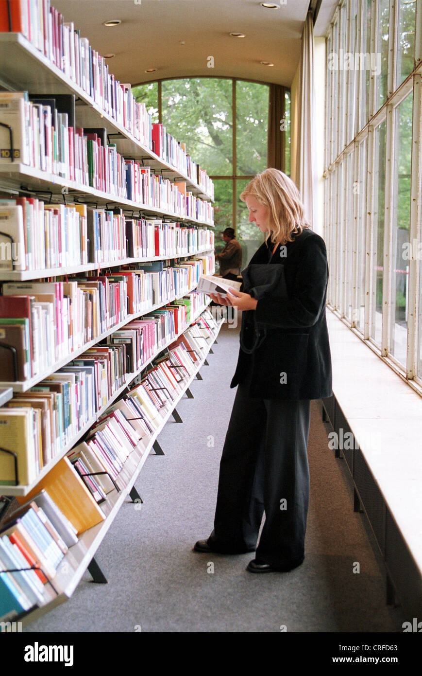 Berlin, Germany, a student reads in the American Memorial Library Stock ...