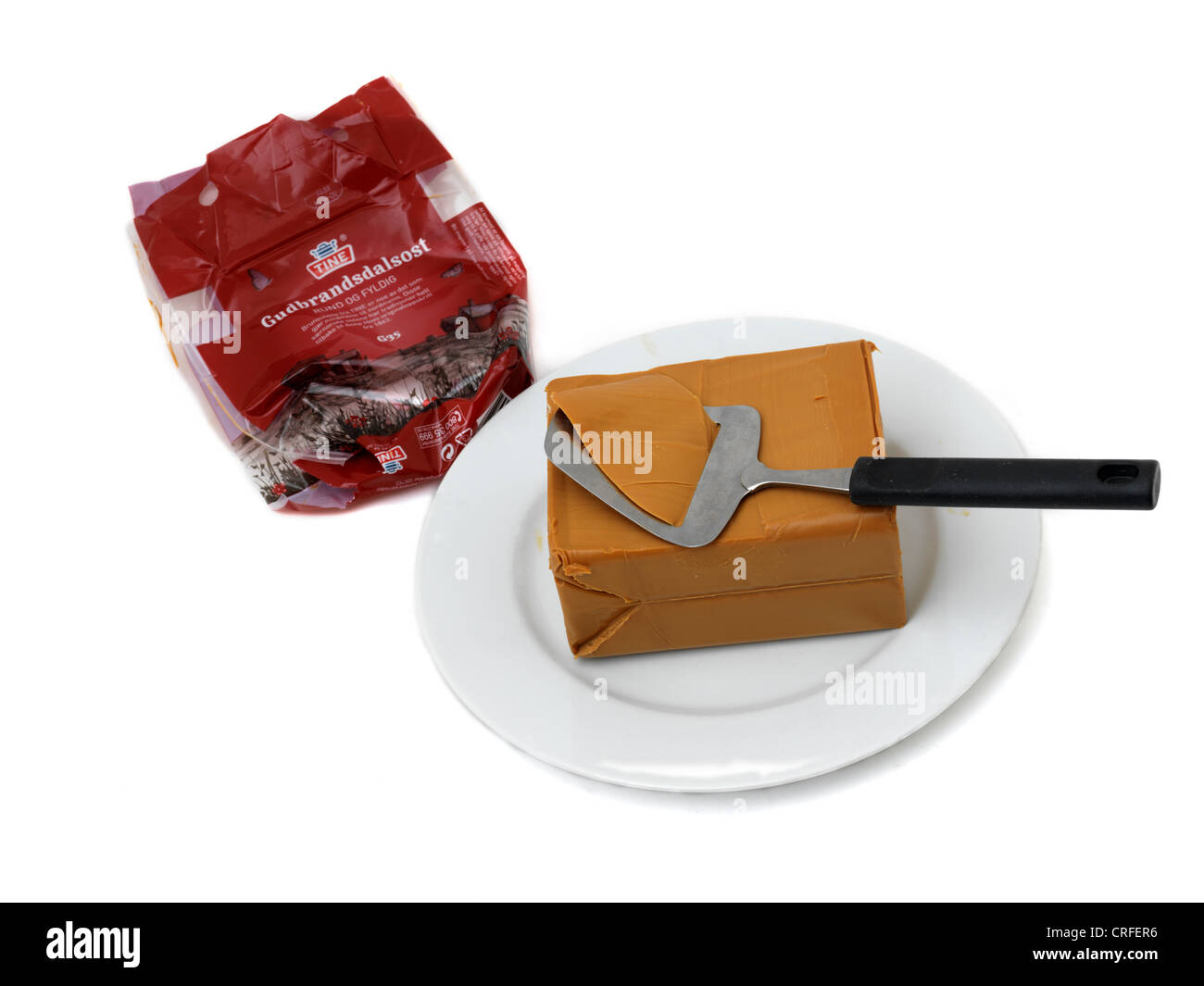 Norwegian Gjetost Brown Goats Cheese On A Plate With Cheese Slicer ...