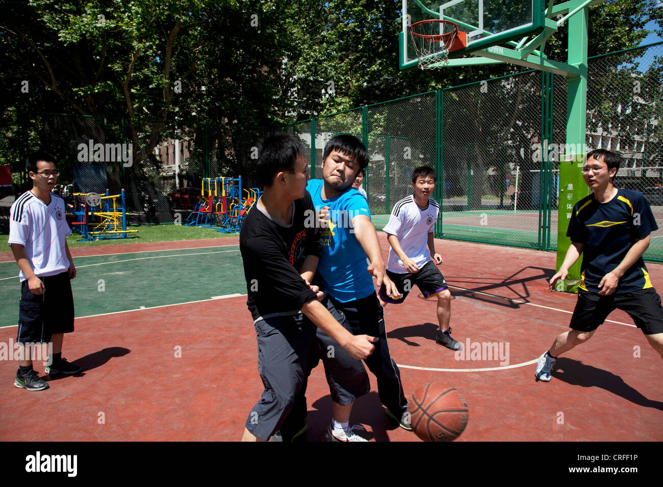 Students playing basketball on campus at Tsinghua University in Beijing ...