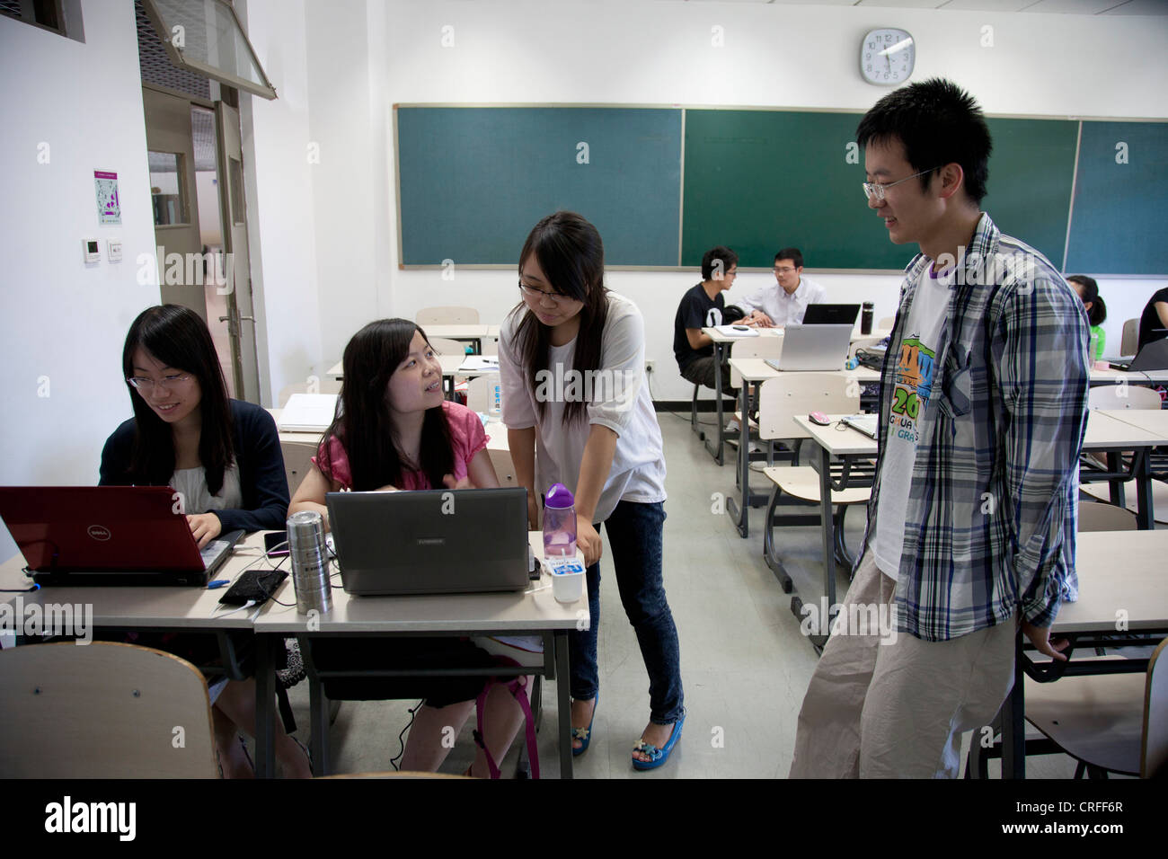 Student talking together in a classroom on campus at Tsinghua ...
