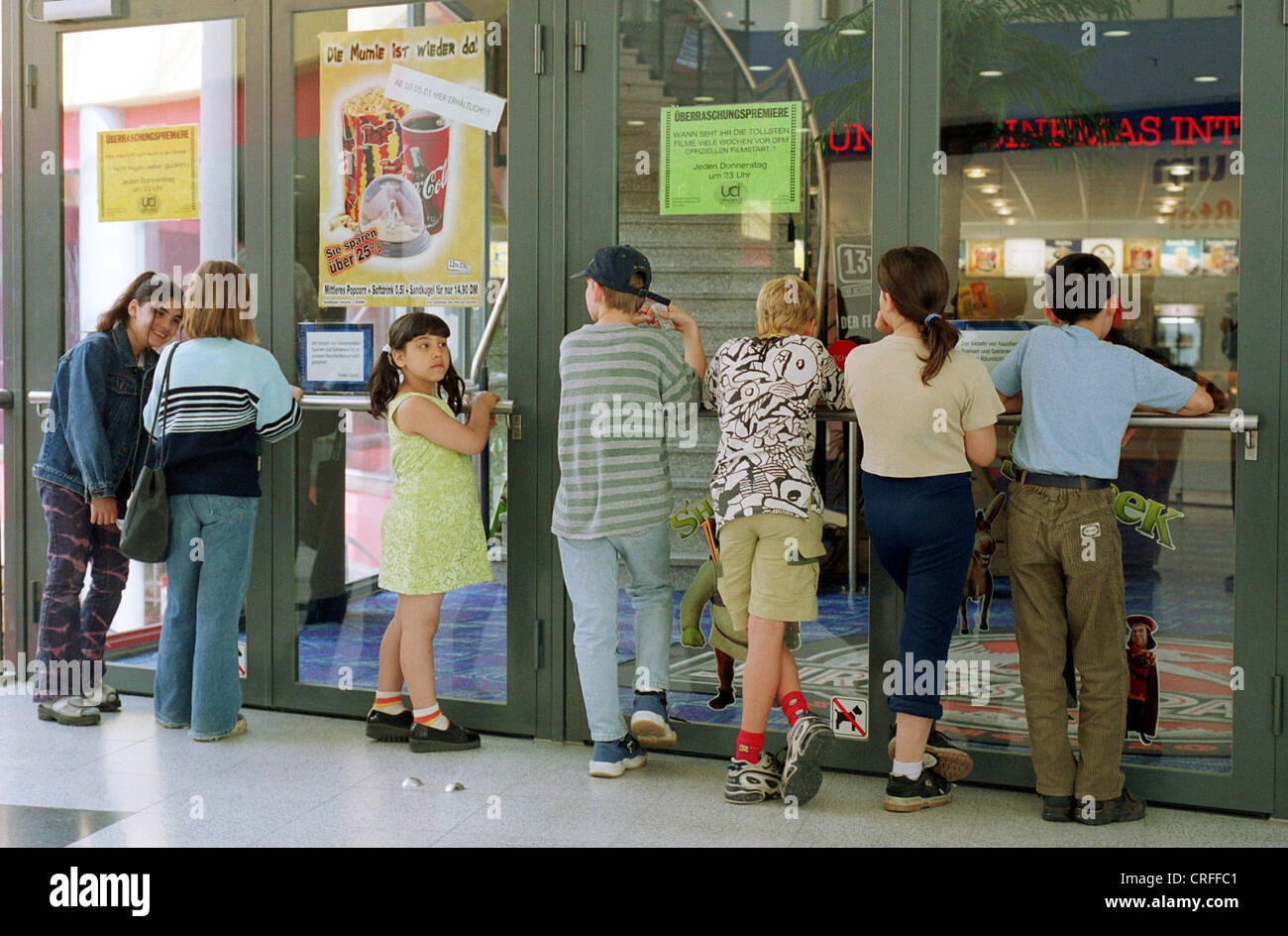 Berlin, Germany, children wait in a line outside a cinema Stock Photo ...
