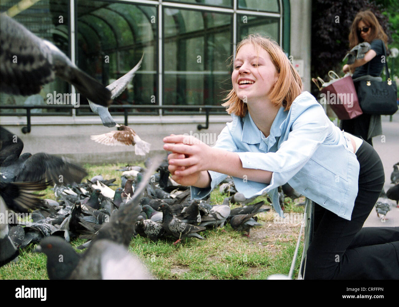 Vienna, Austria, a girl tries to catch a pigeon Stock Photo - Alamy