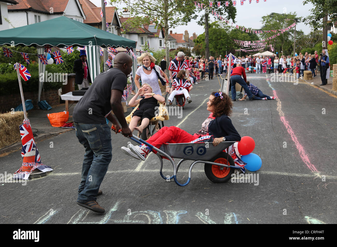 Children wheelbarrow race hi-res stock photography and images - Alamy